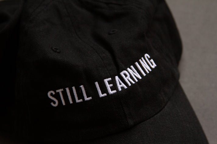 STILL LEARNING hat – For the Birds Trapped in Airports